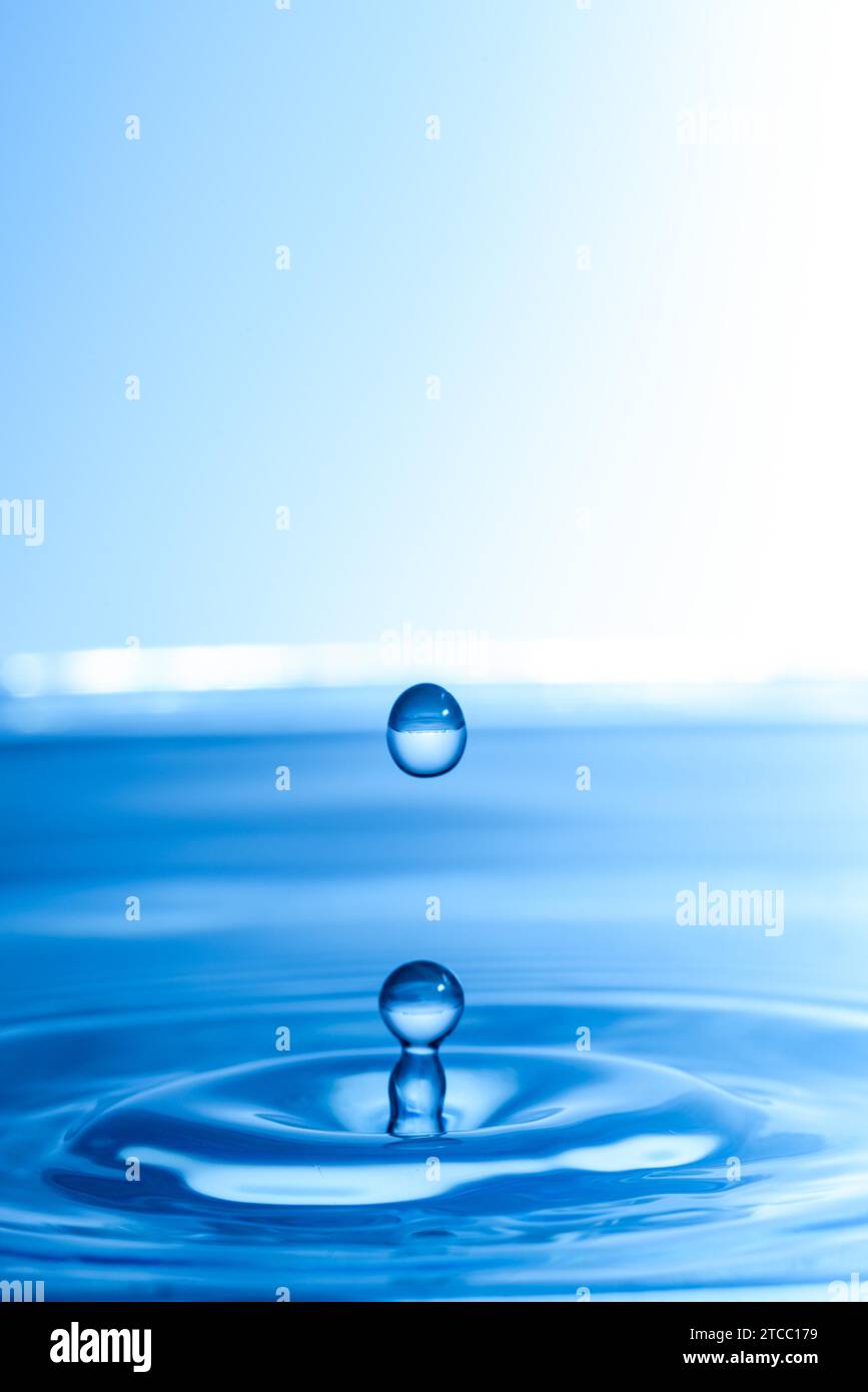 Water drop fall into water Stock Photo - Alamy