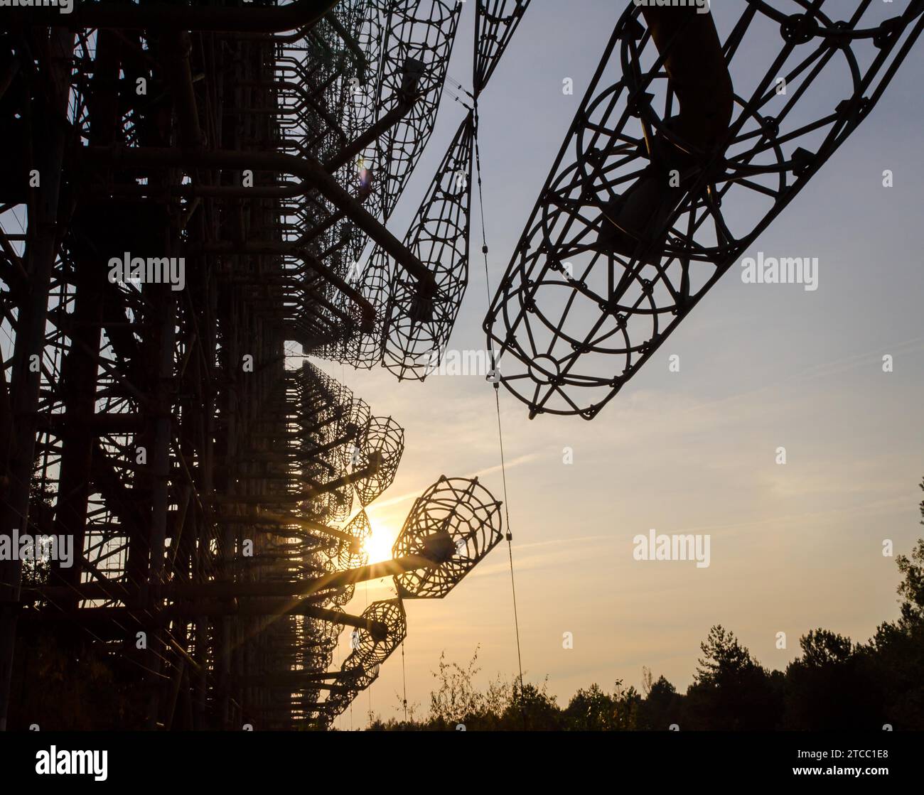 Secret army antenna radar in the forest at sunset with sun rays in ...
