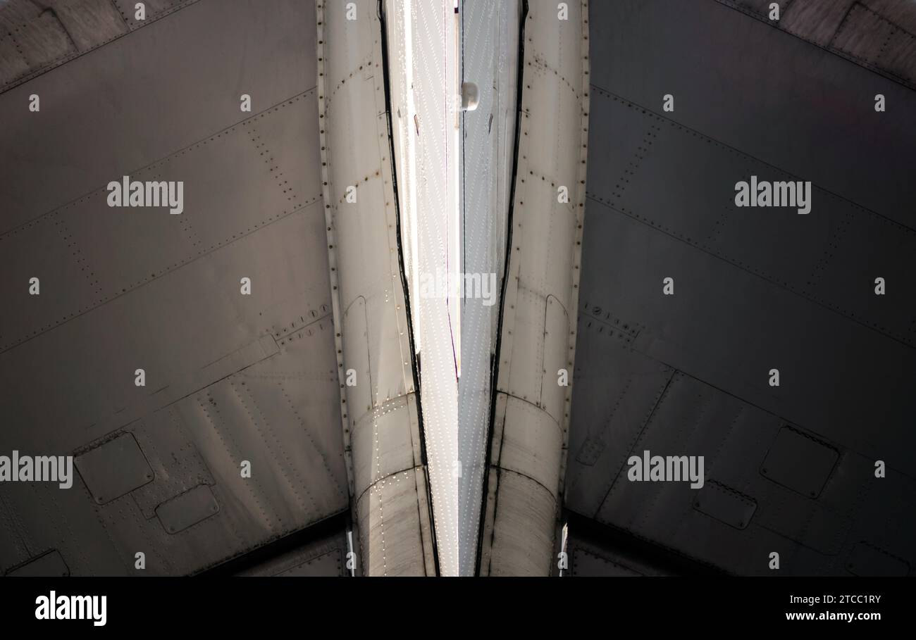 Technical aviation background fragment of an airplane wings close up ...