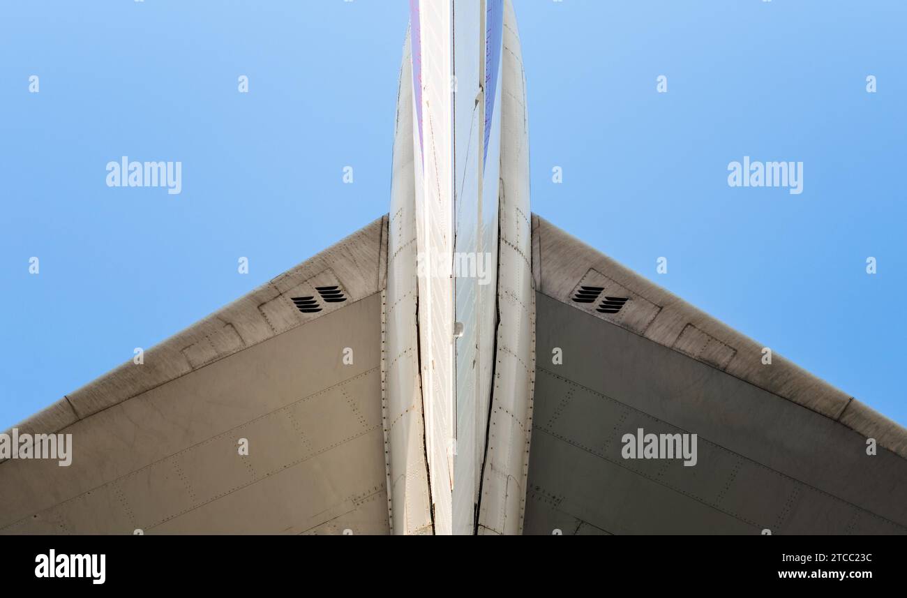 Fragment of airplane wings on a background of blue sky isolated ...
