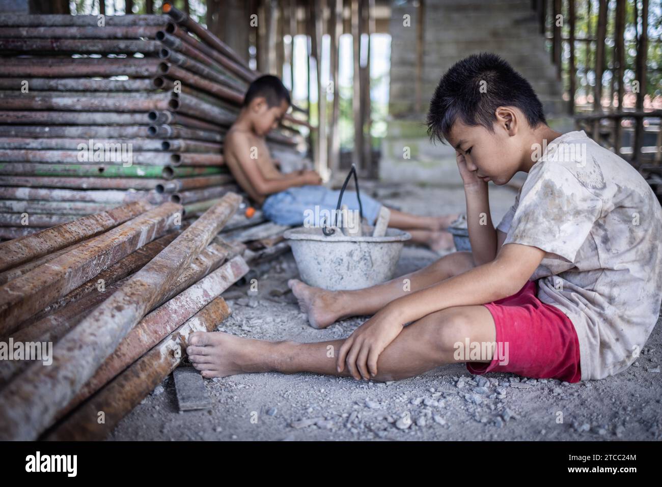Concept of child labor, poor children being victims of construction ...