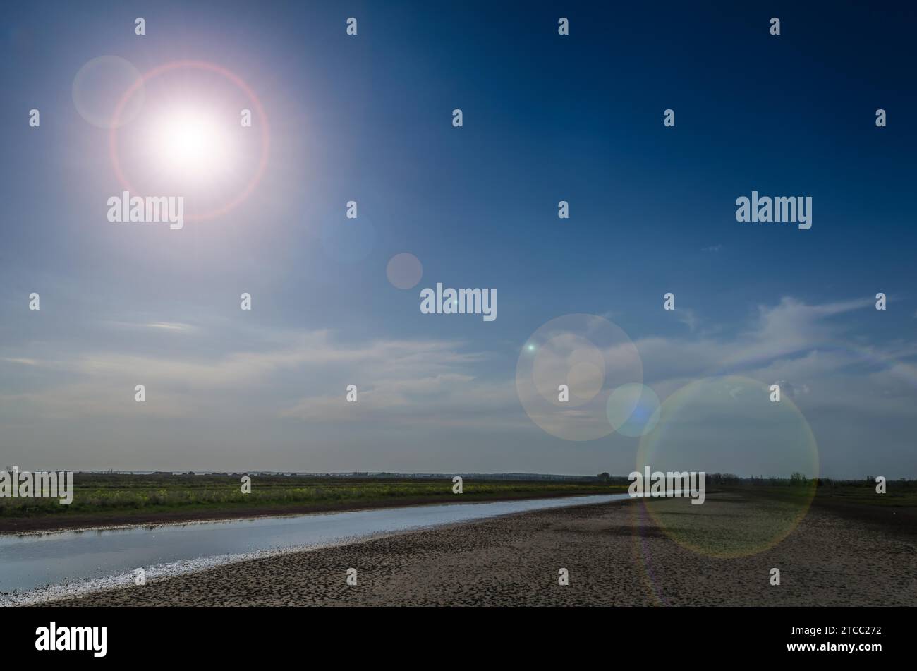 Day calm landscape with river and sun Stock Photo - Alamy