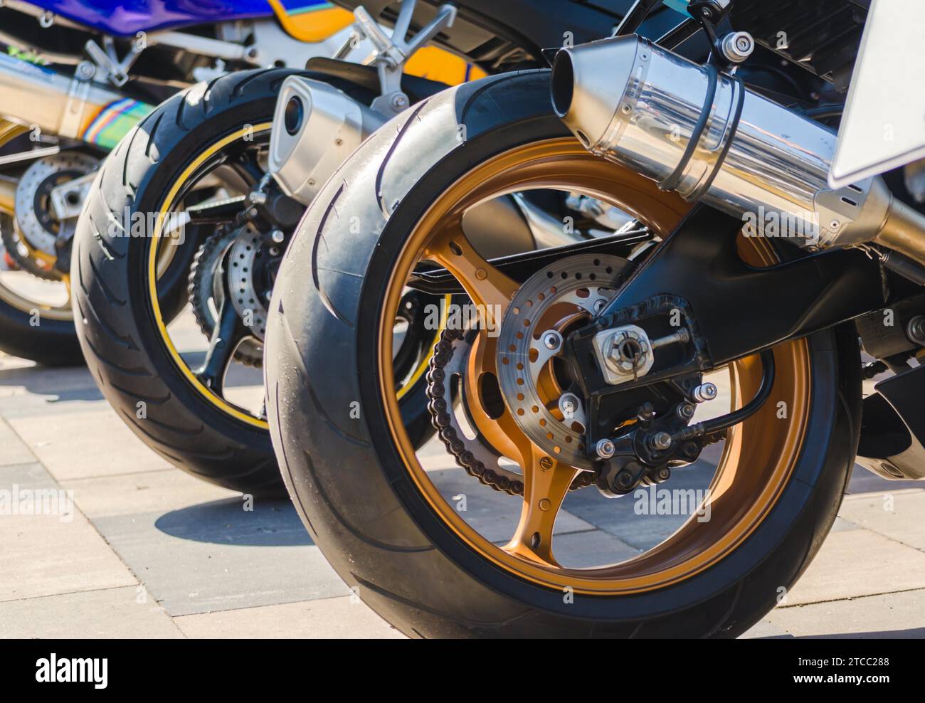 Row of rear wheels of sports bikes in competition close up Stock Photo ...