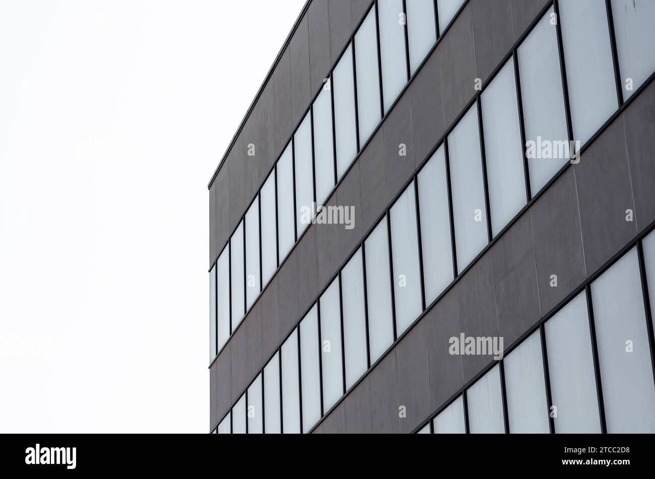Many empty windows of a concrete building Stock Photo - Alamy