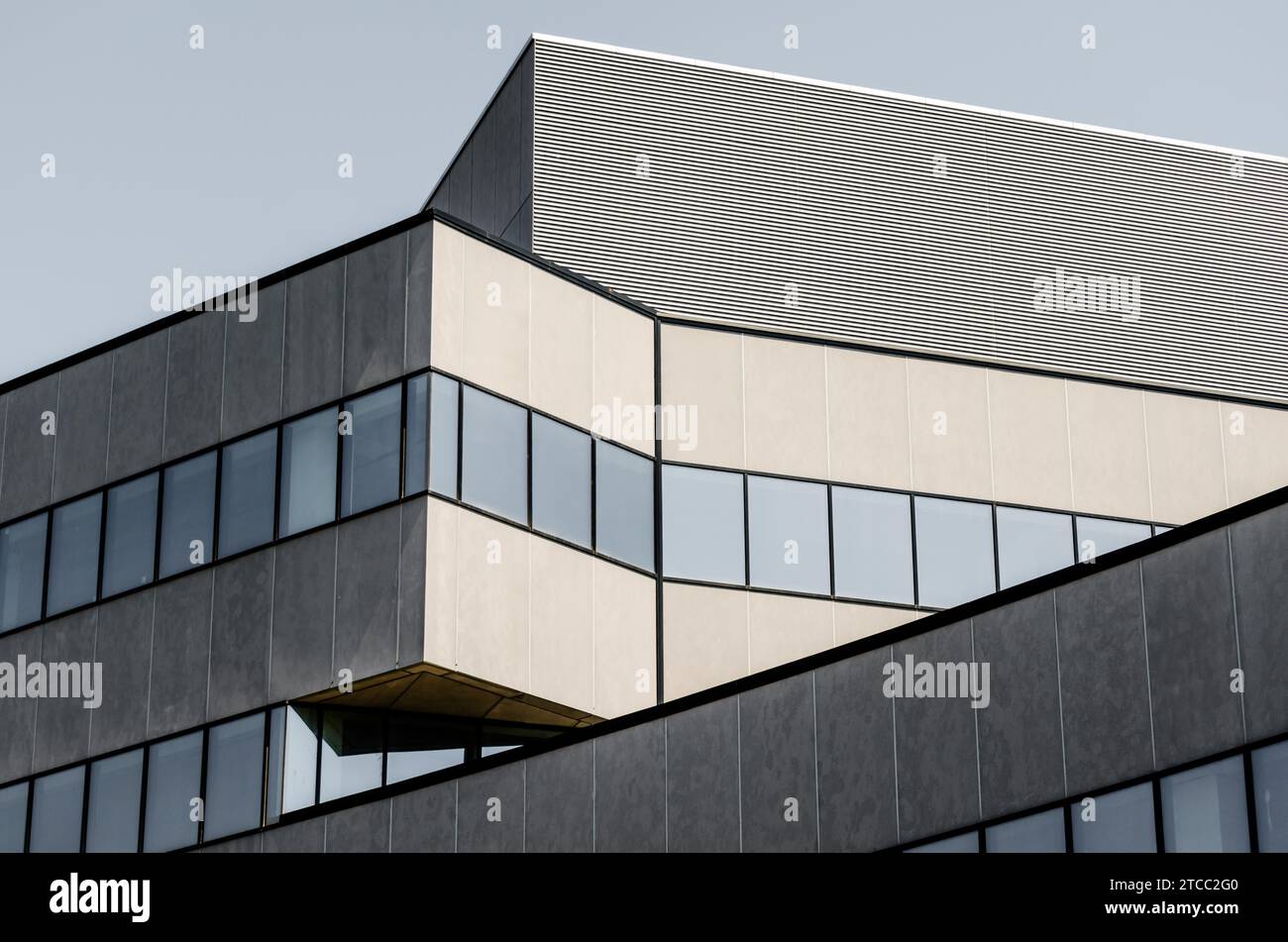 Tall large concrete building with empty windows Stock Photo - Alamy