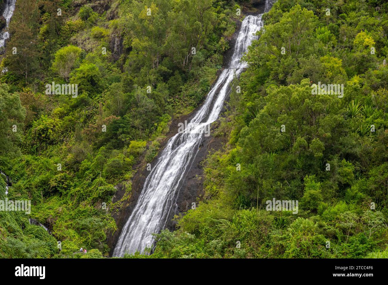 Waterfall on a green mountain at french island Reunion in the indian ...