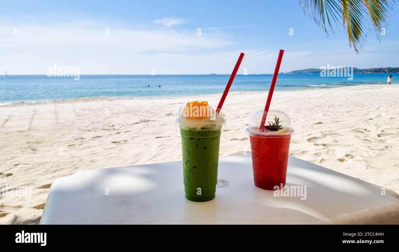 Cold green tea and strawberry shake tropical drinks on the beach of Koh ...