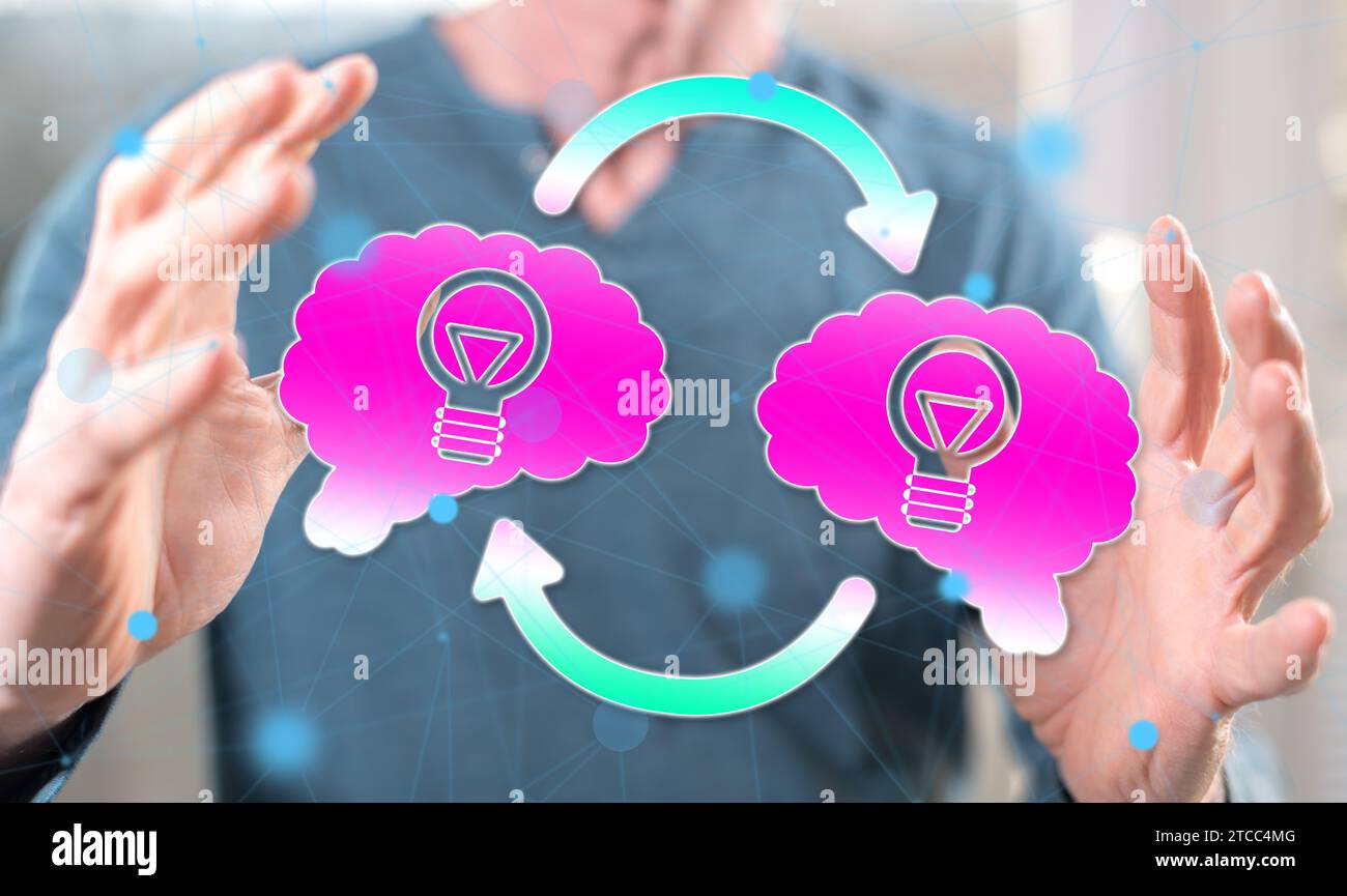 Knowledge sharing concept between hands of a man in background Stock ...