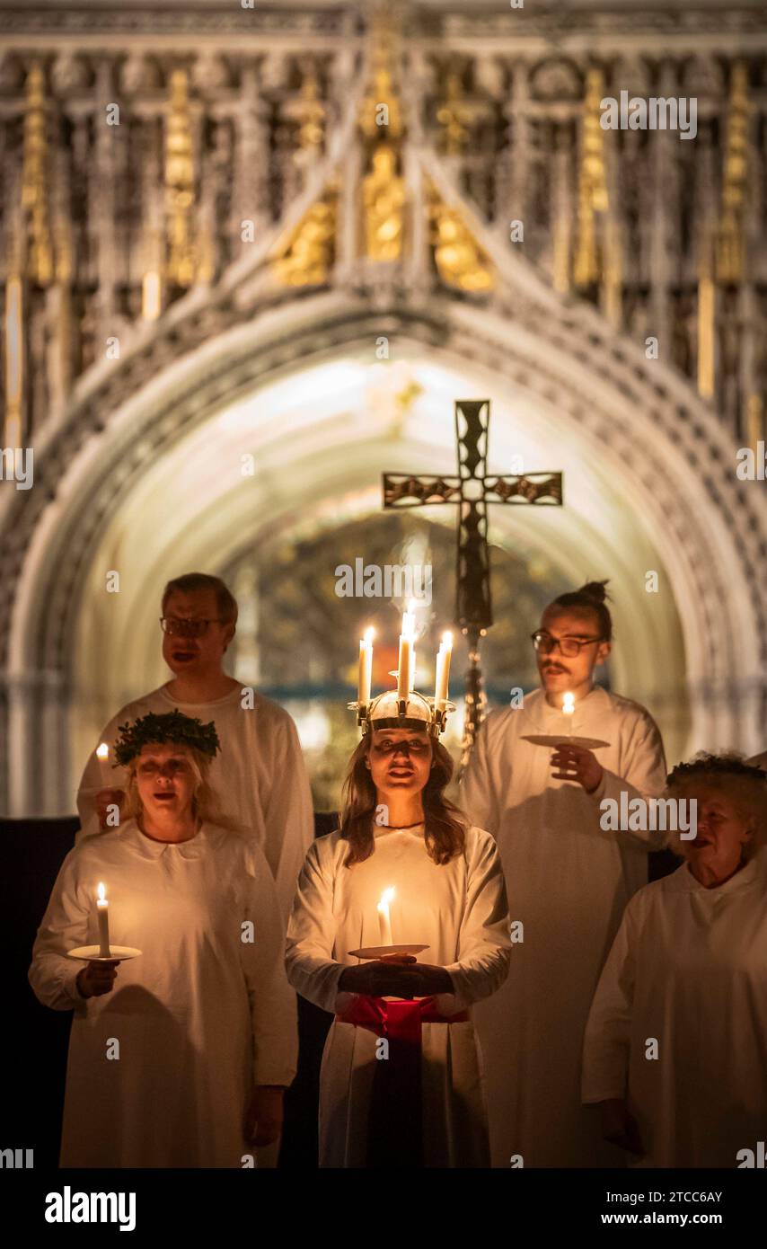 Linnea Isén wears a crown of candles symbolising St Lucy as she leads ...