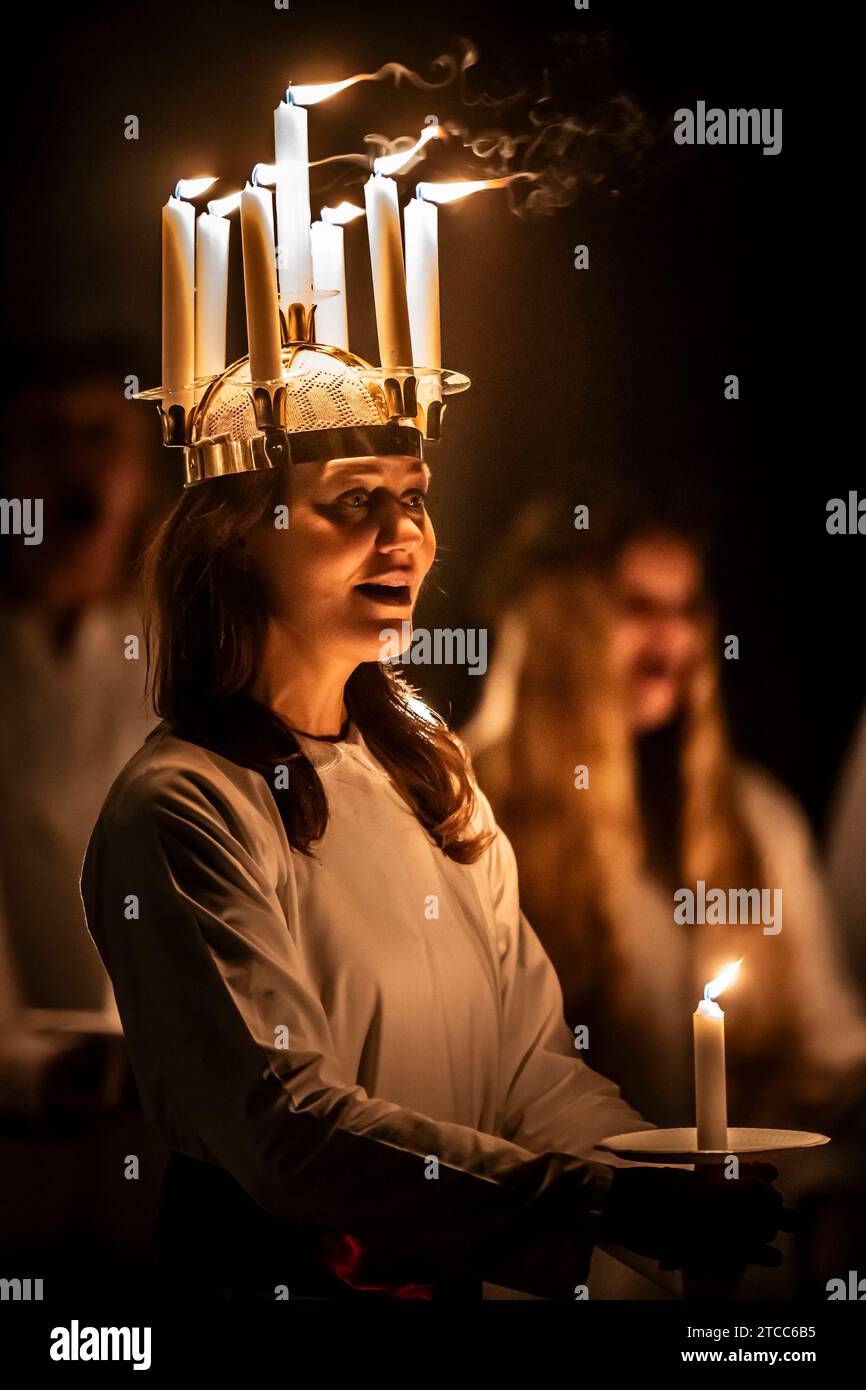 Linnea Isén wears a crown of candles symbolising St Lucy as she leads ...