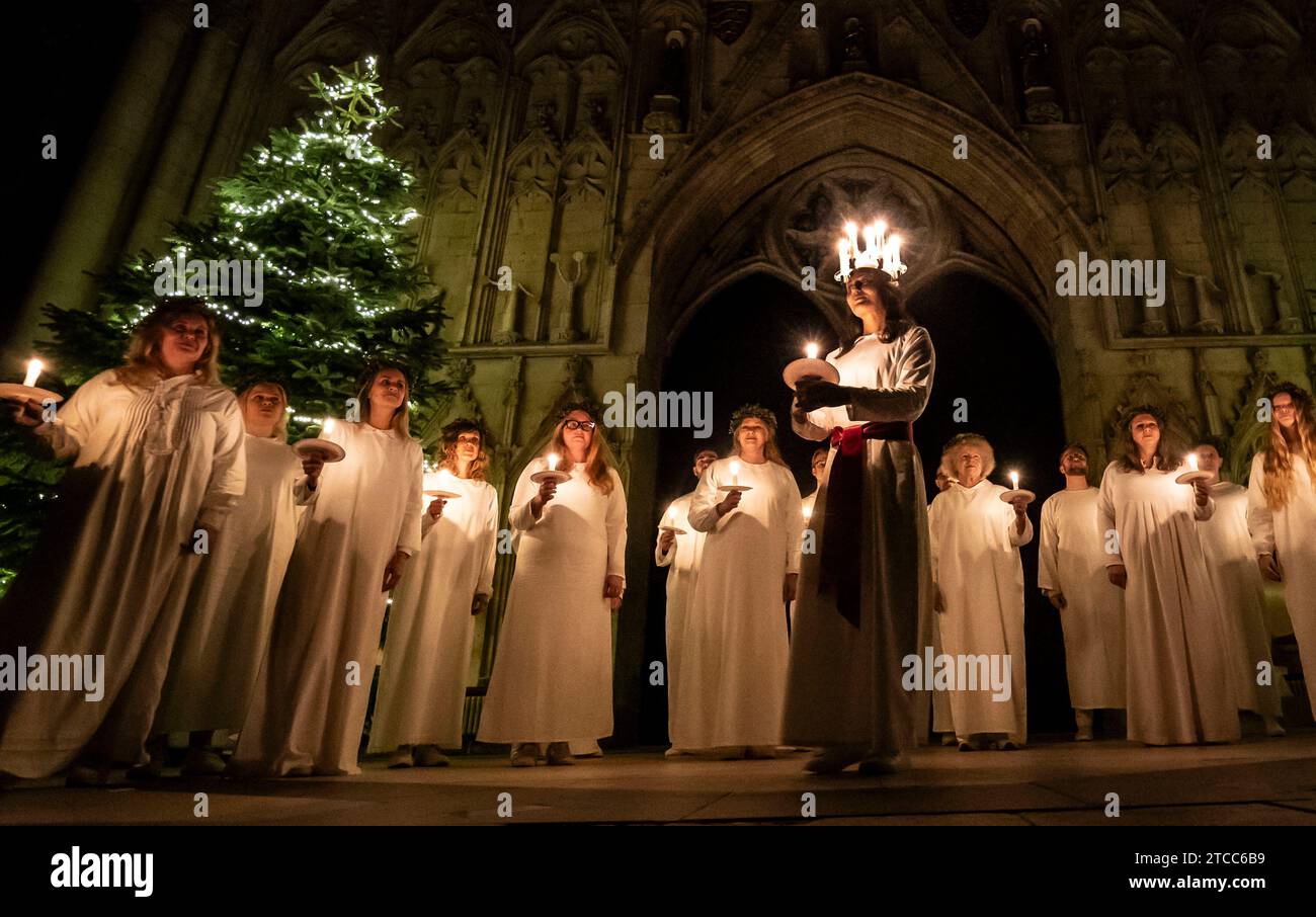 Linnea Isén wears a crown of candles symbolising St Lucy as she leads ...