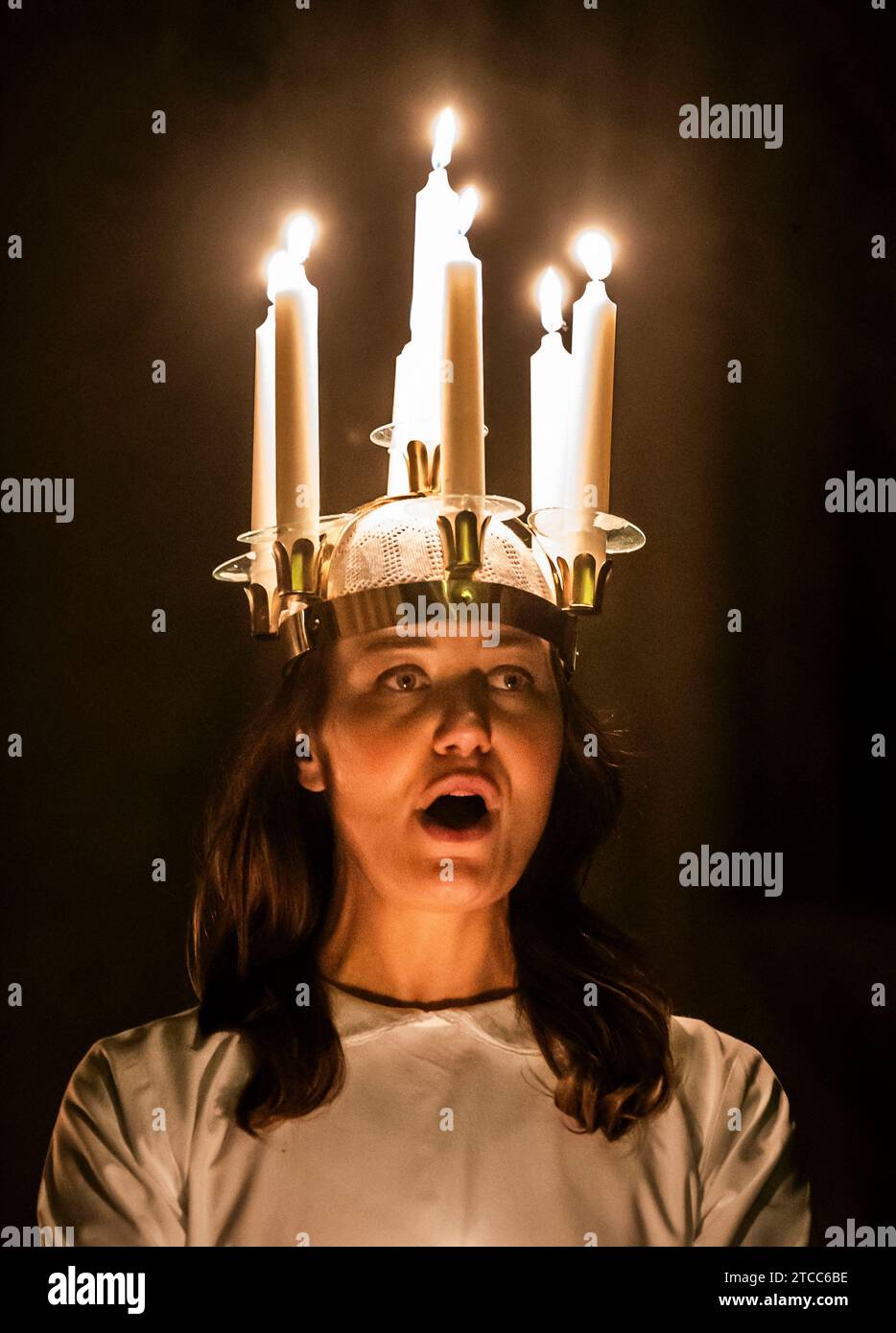 Linnea Isén wears a crown of candles symbolising St Lucy as she leads ...