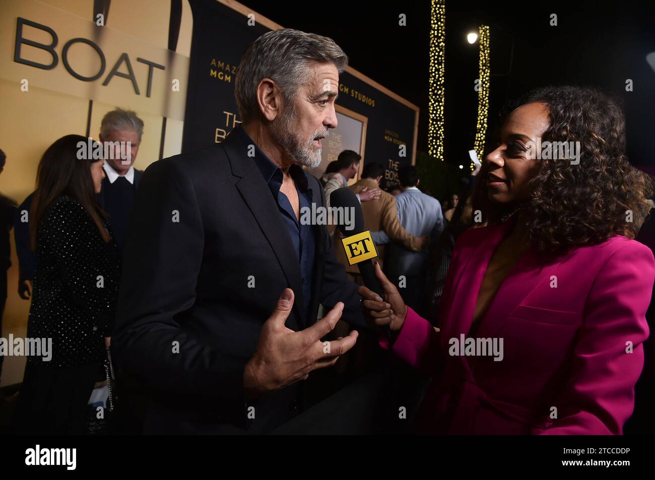 George Clooney, left, and Nischelle Turner attend the premiere of "The ...
