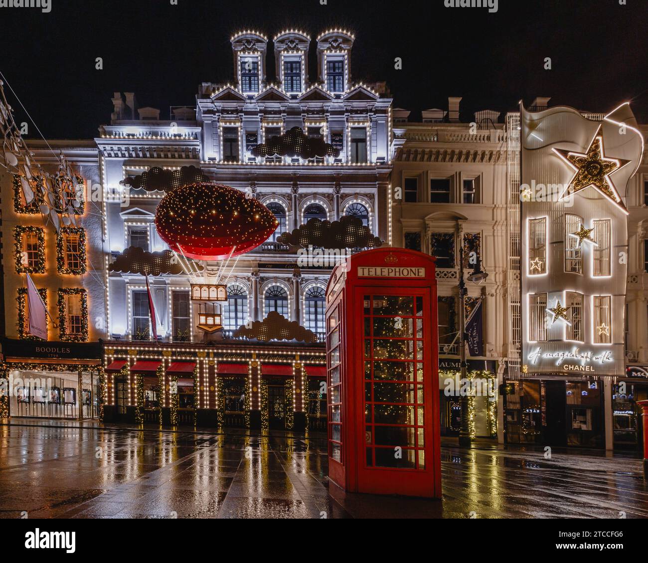 Rain and reflections outside Boodles, the Cartier Store, and Chanel in ...