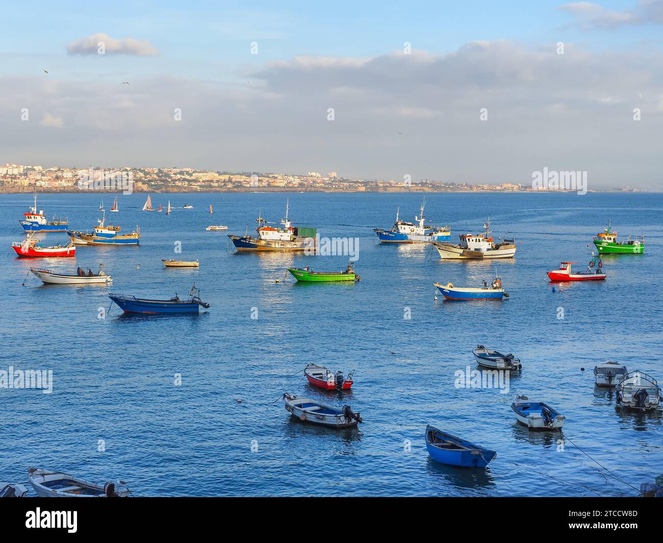 Coastline of Atlantic Ocean, small bay with many colorful fishing boats ...