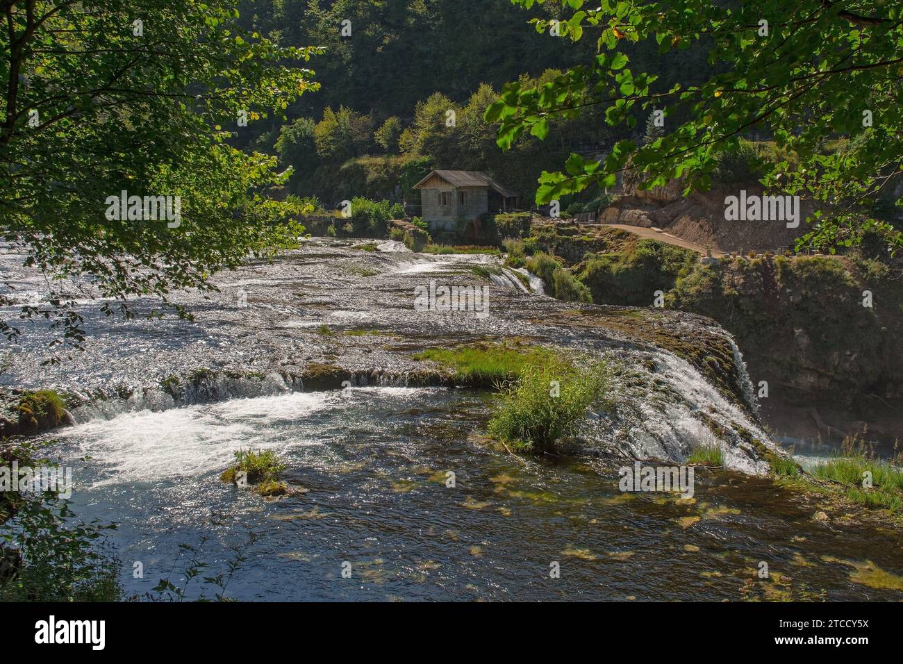 The River Una flowing over the top of Strbacki Buk, a terraced ...
