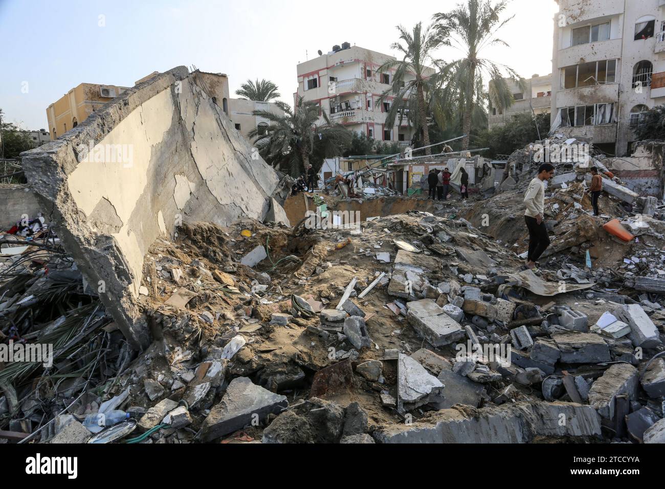 Rafah, Palestinian Territories. 12th Dec, 2023. Palestinians inspect ...