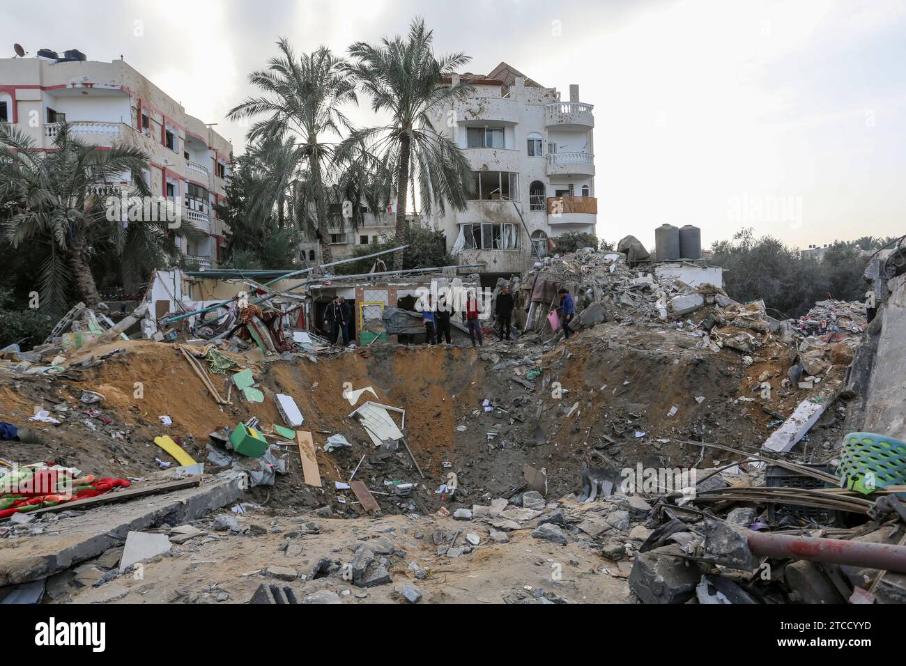 Rafah, Palestinian Territories. 12th Dec, 2023. Palestinians inspect ...