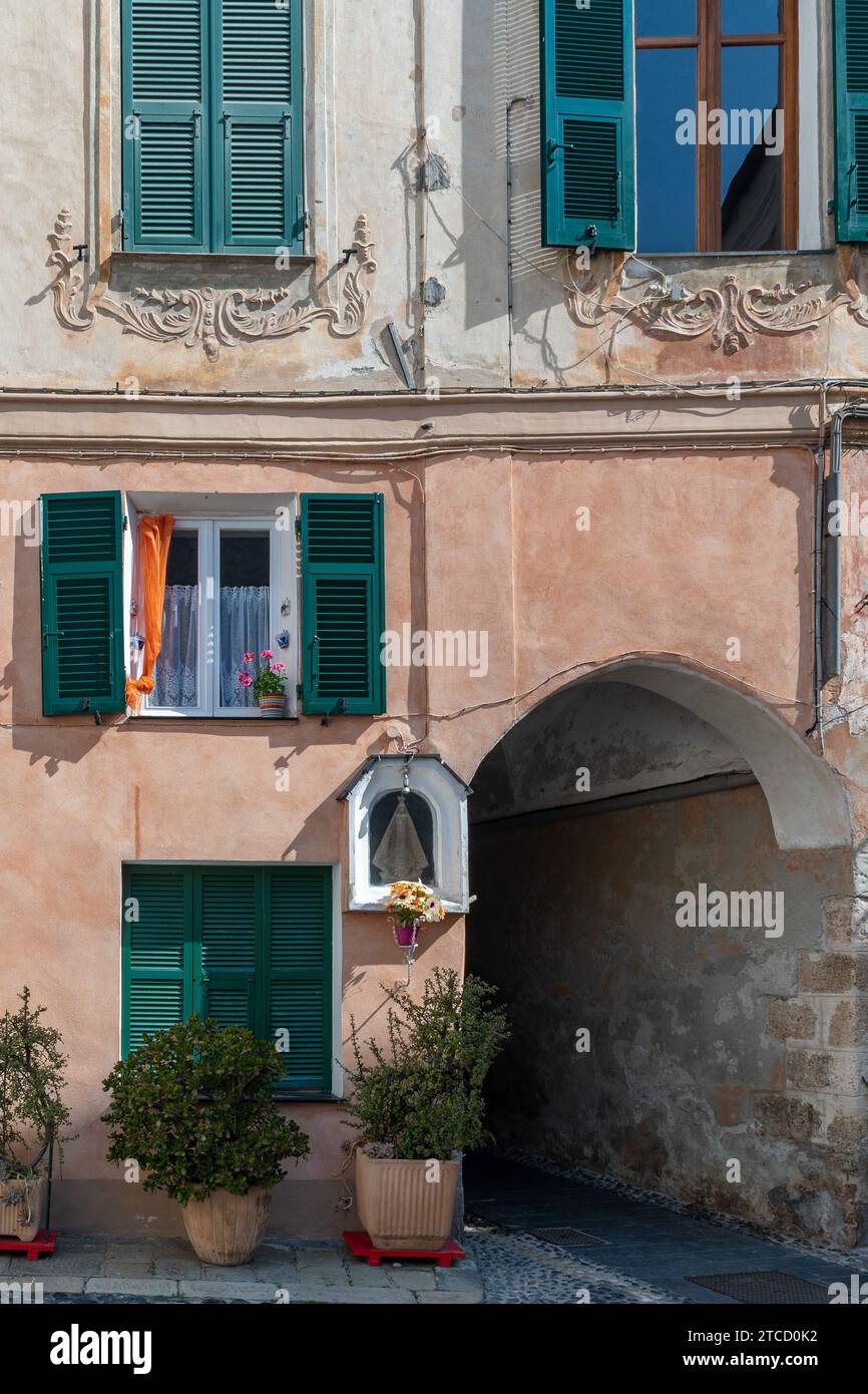 Exterior of an old building with a votive shrine in the medieval ...