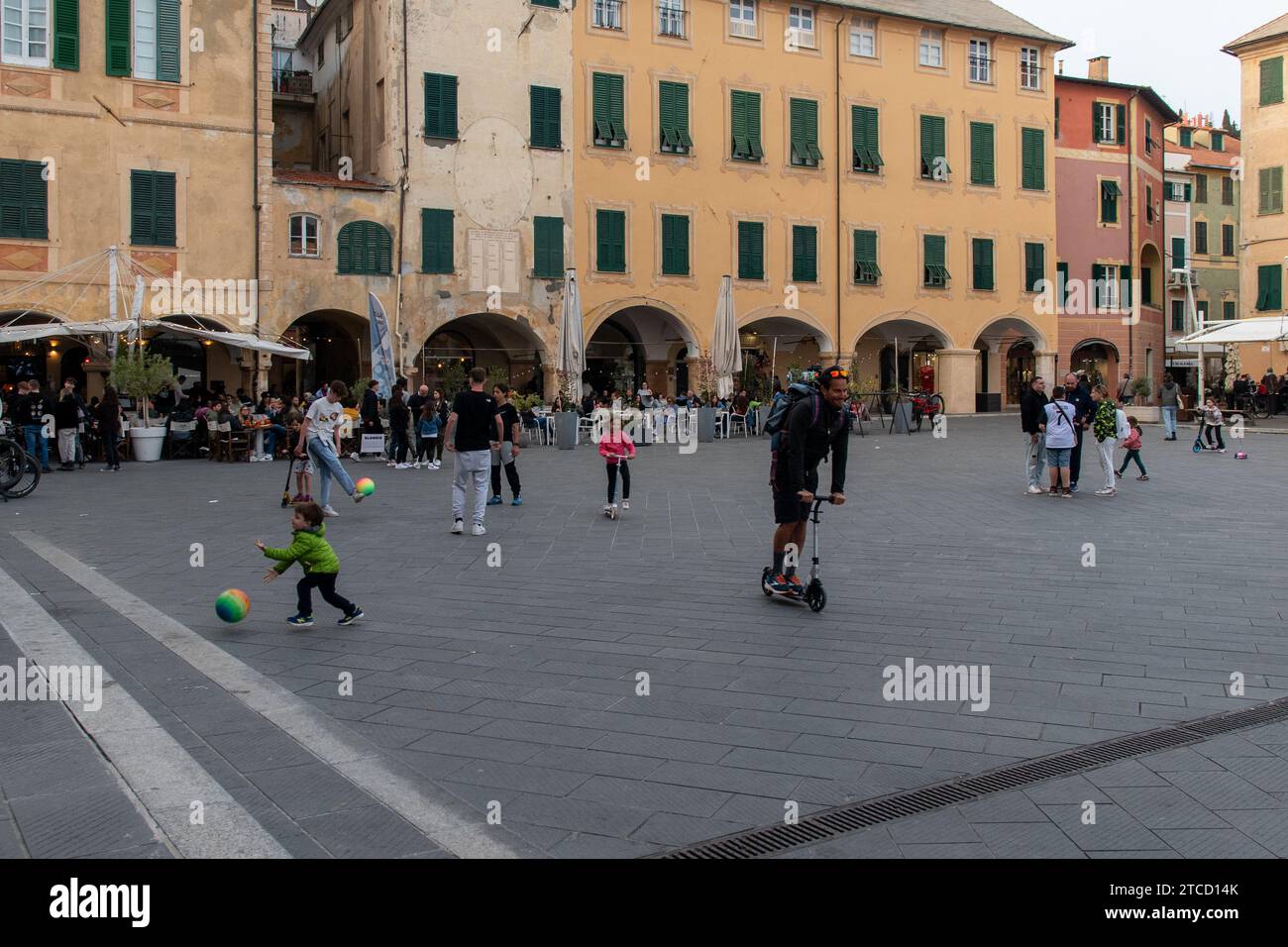 Children playing soccer in Piazza Vittorio Emanuele II, the main square ...
