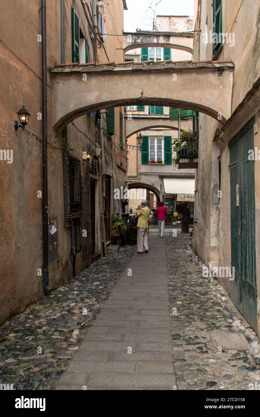 Narrow alley with the typical arches between the houses in the medieval ...