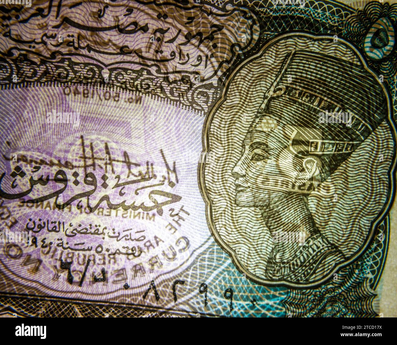 A closeup macro shot of a paper currency bill, with various elements of ...