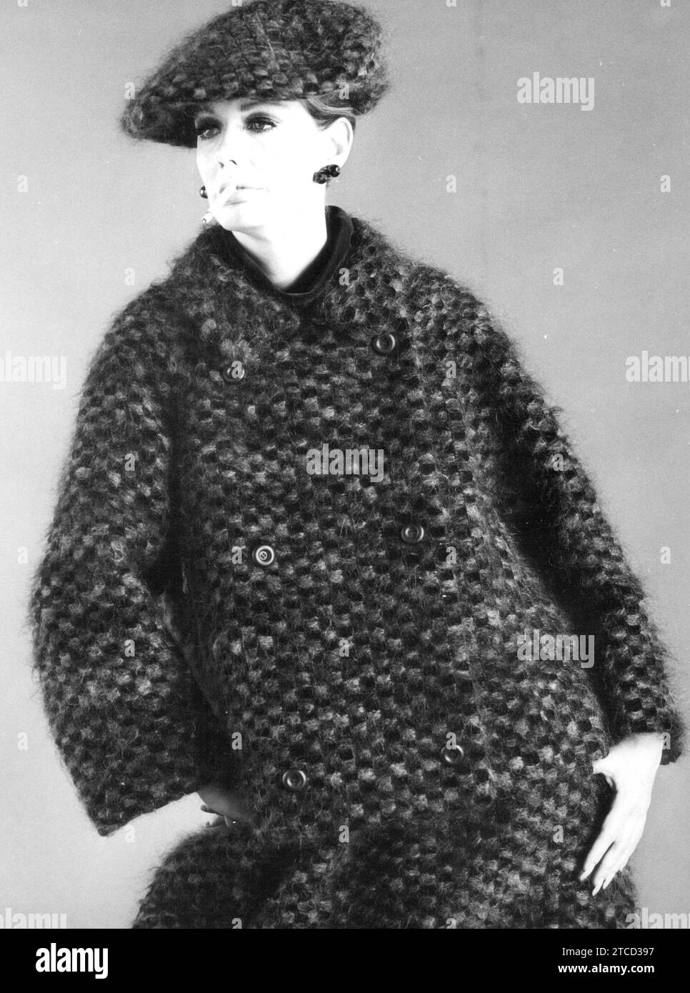 12/31/1963. In the Image, Large jacket with double buttons. Raglan sleeves and small collar ...