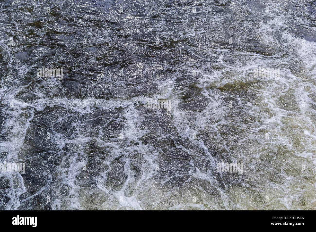 Close up detail of fierce white water river rapids from a clean deep ...