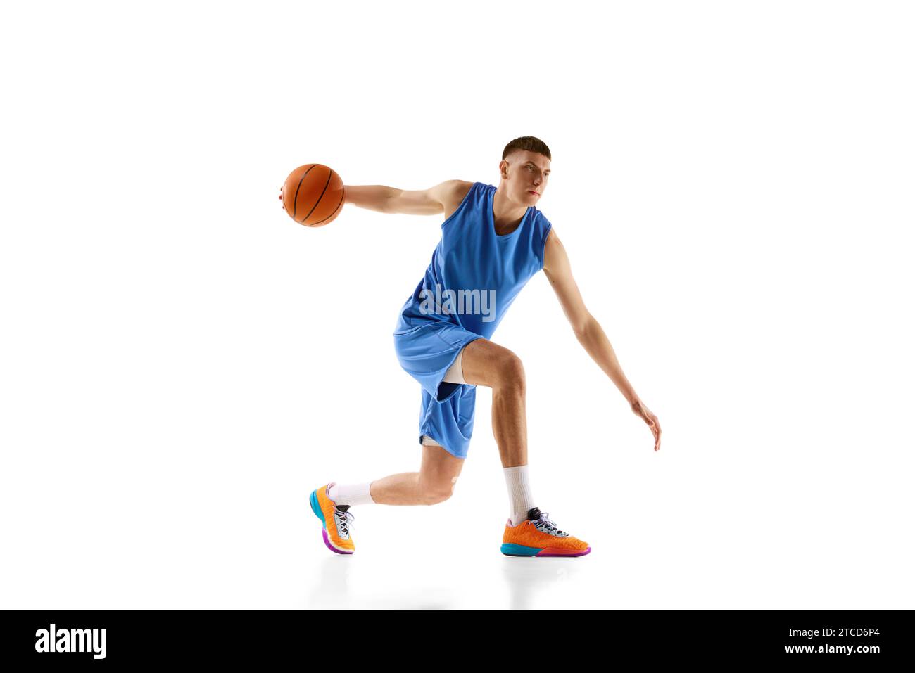 Dynamic image of young man in blue uniform, basketball player in motion ...