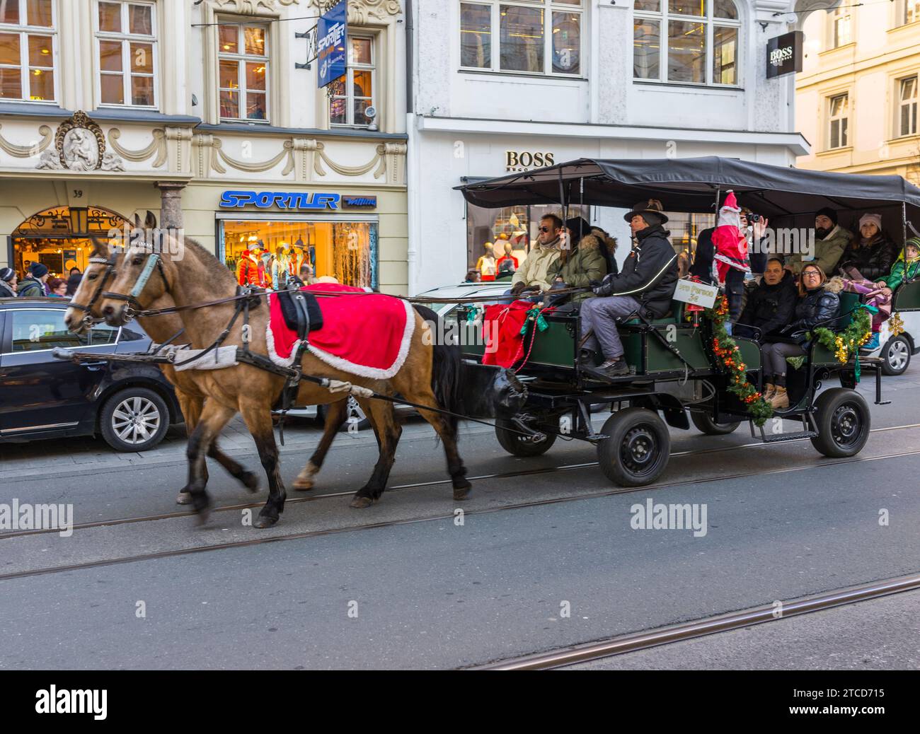 Austria. State of Tyrol. City of Innsbruck. Tourists on a carriage in ...