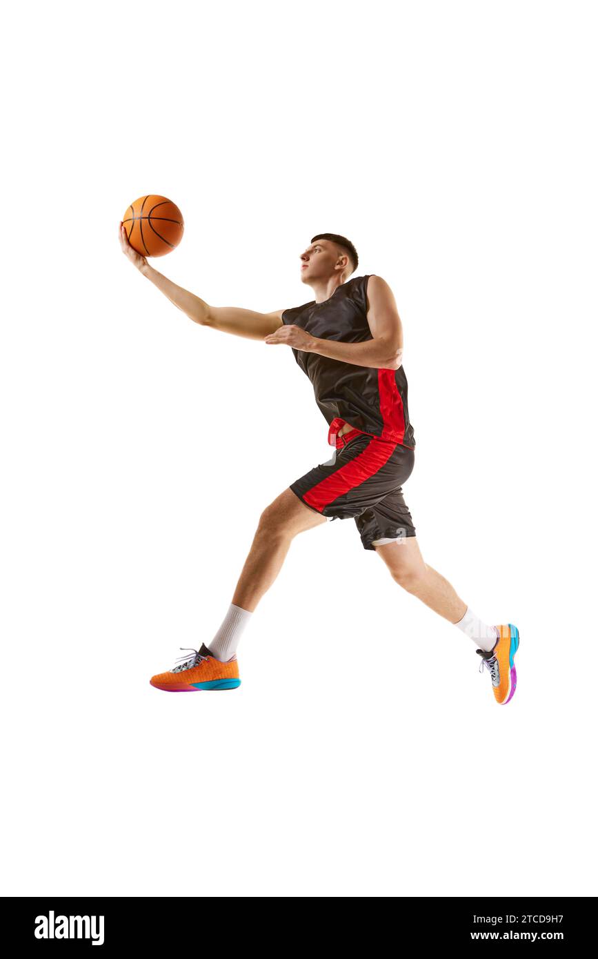 Slum dunk. Winner. Young guy, basketball player in motion, practicing ...