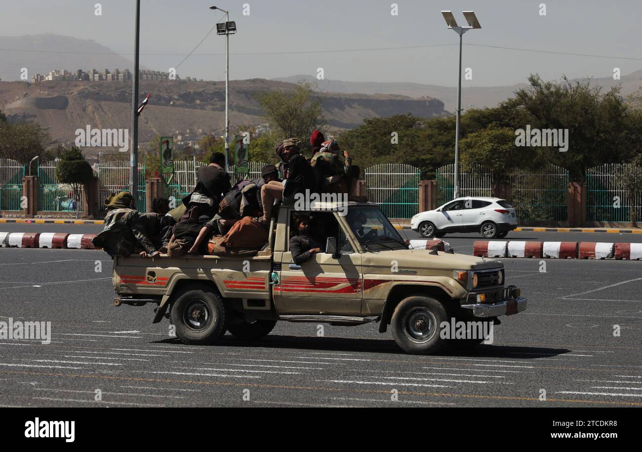 SANAA, Sanaa, Yemen. 12th Dec, 2023. Houthi fighters ride a truck in ...