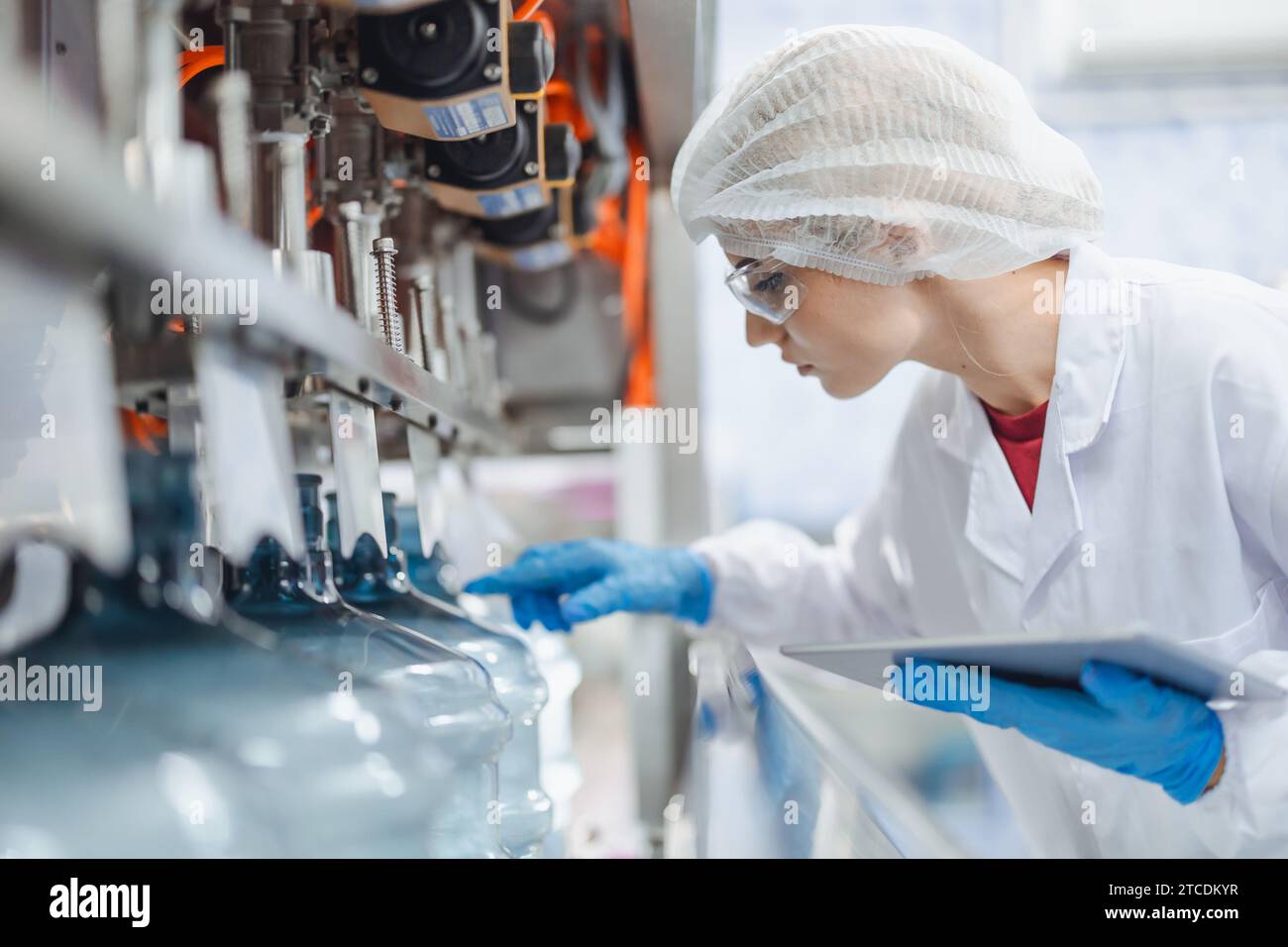 caucasian women worker working in water plant factory clean hygiene ...