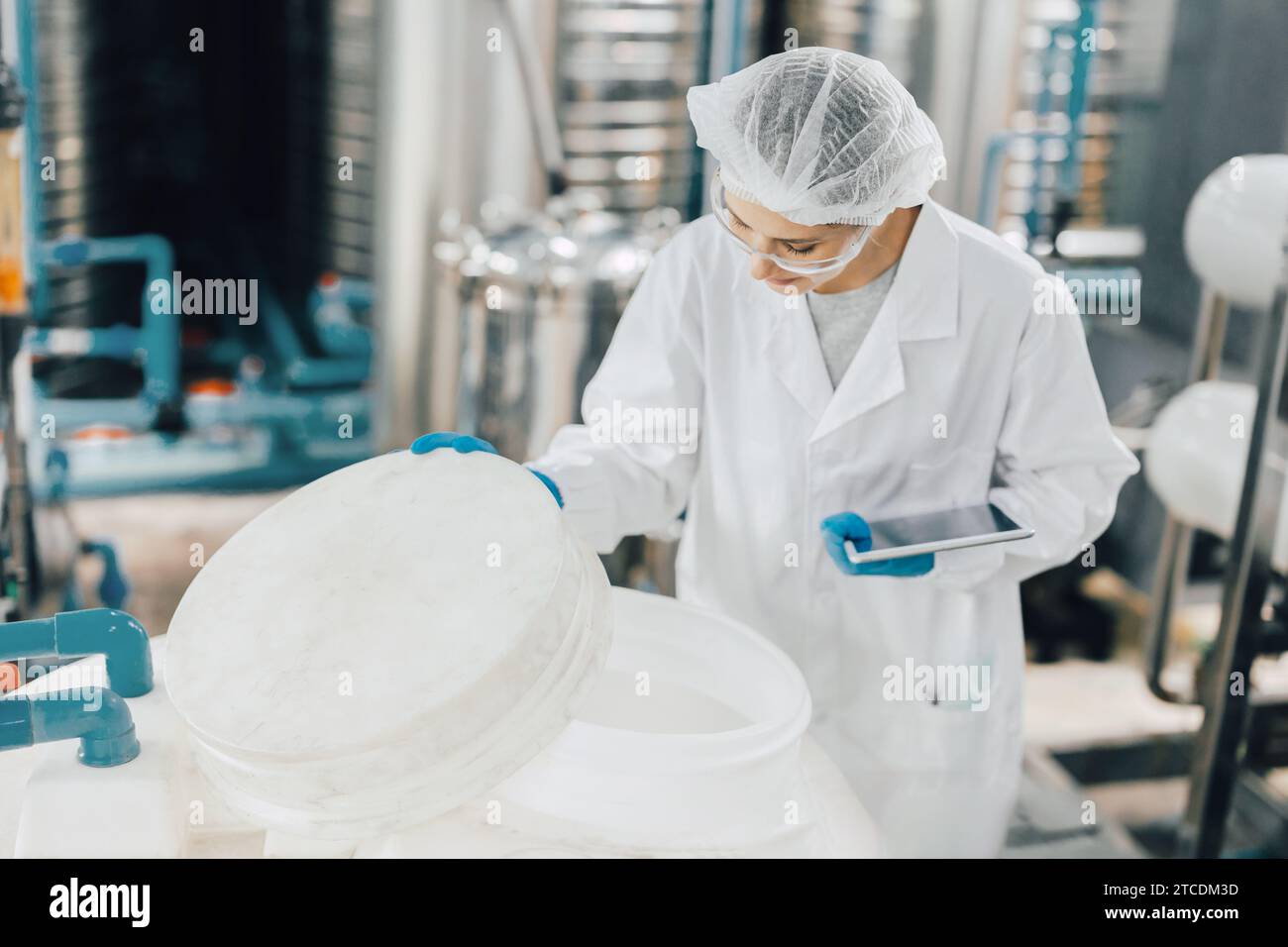 hygiene staff worker in foods and drinks clean factory. working women ...