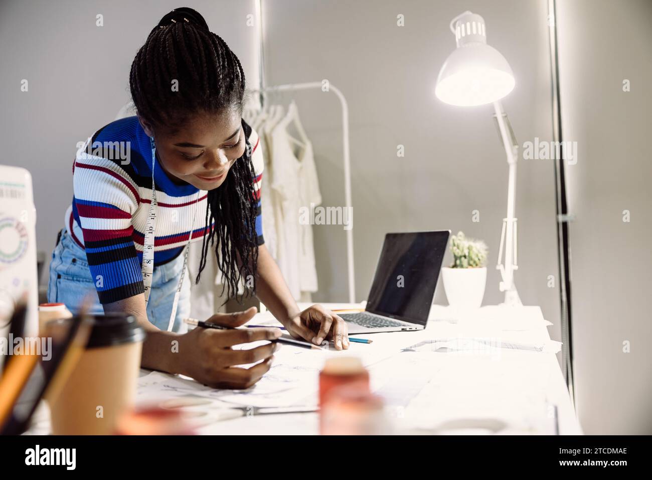 Tailor clothing designer staff worker happy working in cutting studio ...