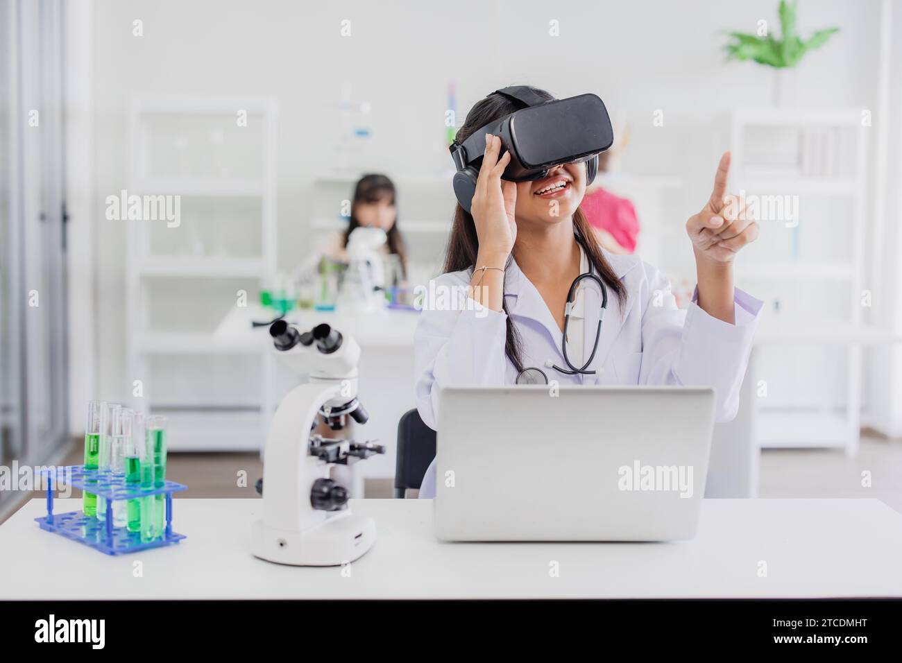 Student using VR glasses headset technology for help visual learning ...