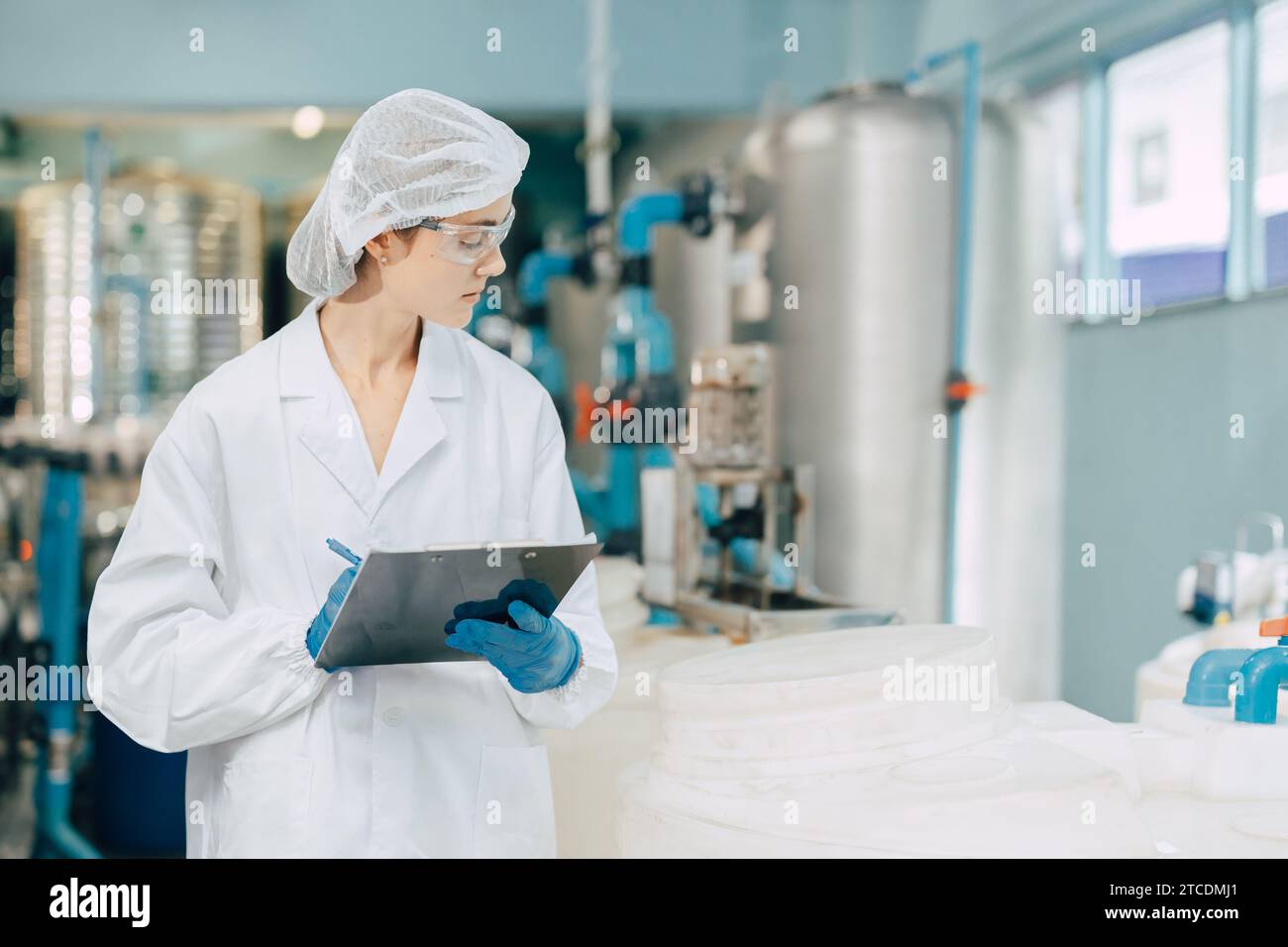 hygiene staff worker in foods and drinks clean factory. working women ...