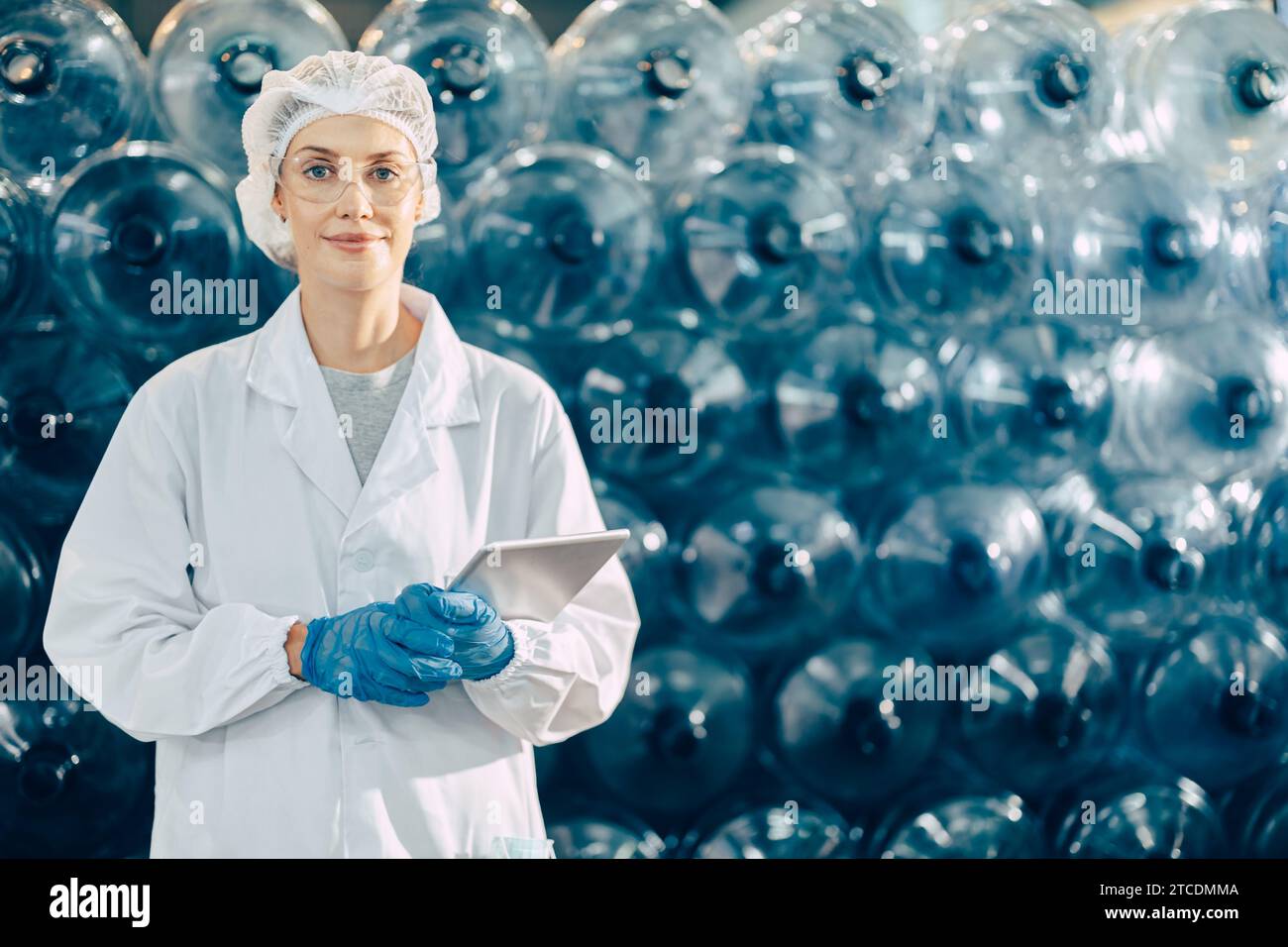 women worker working in drinking water plant factory checking count ...