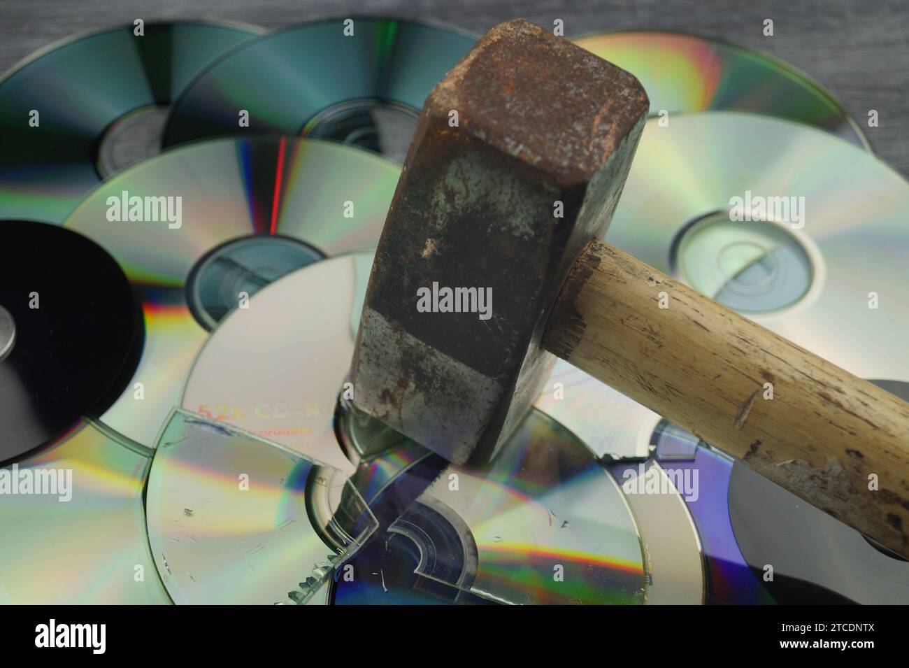 destroyed DVDs and hammer, symbol picture for hacker attack Stock Photo ...