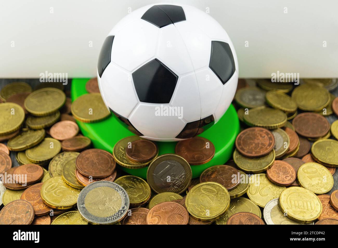 football with Euro coins Stock Photo - Alamy