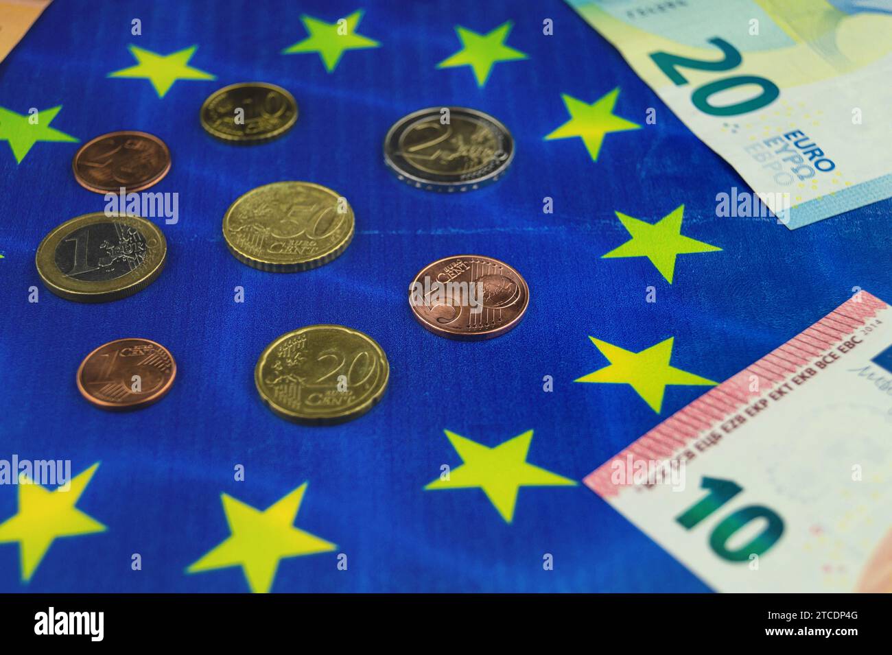 flag of EU with Euro bills and coins, Europe Stock Photo - Alamy