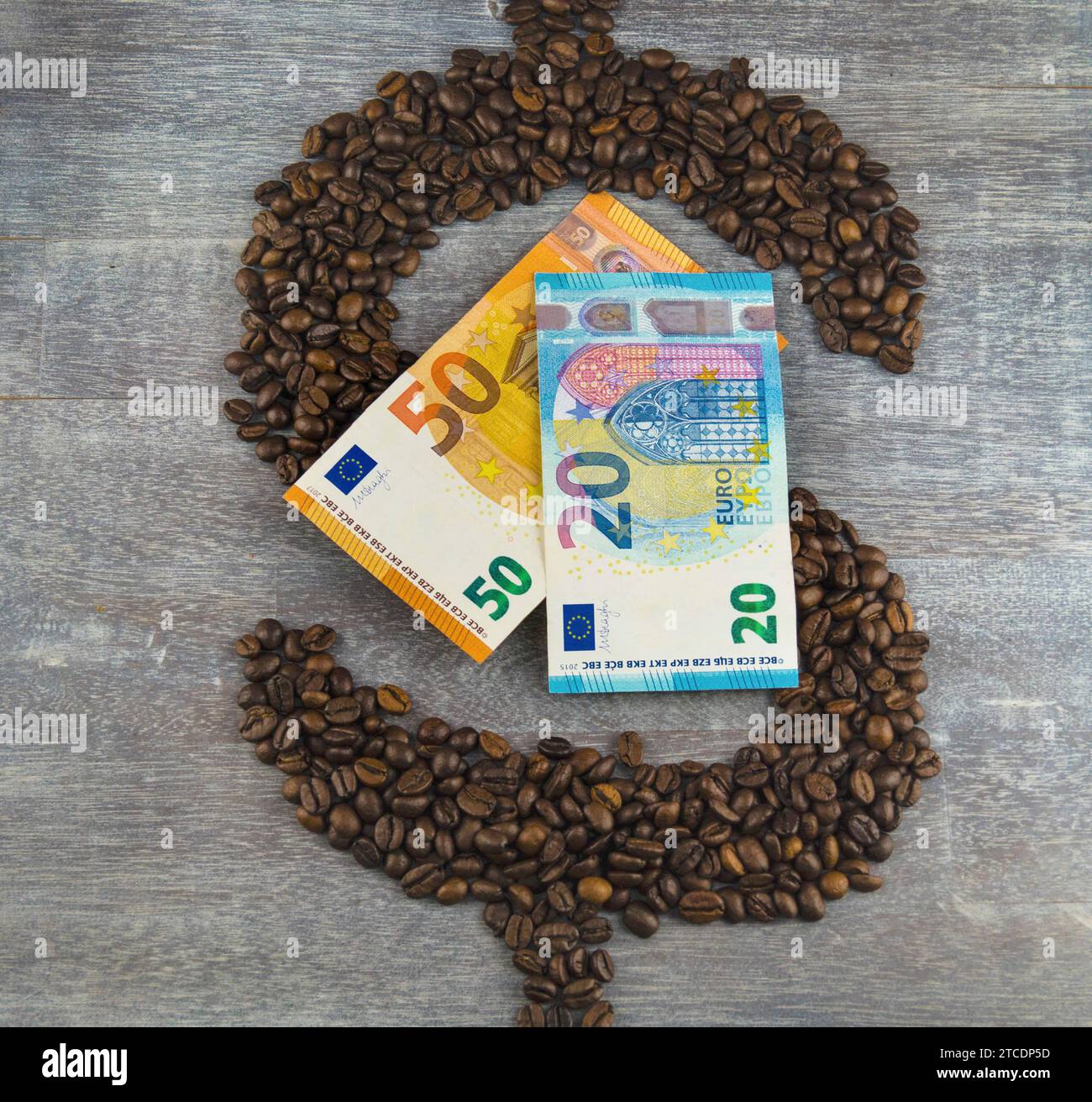 Dollar sign, formed with roasted coffee beans, with Euro bills, coffee ...