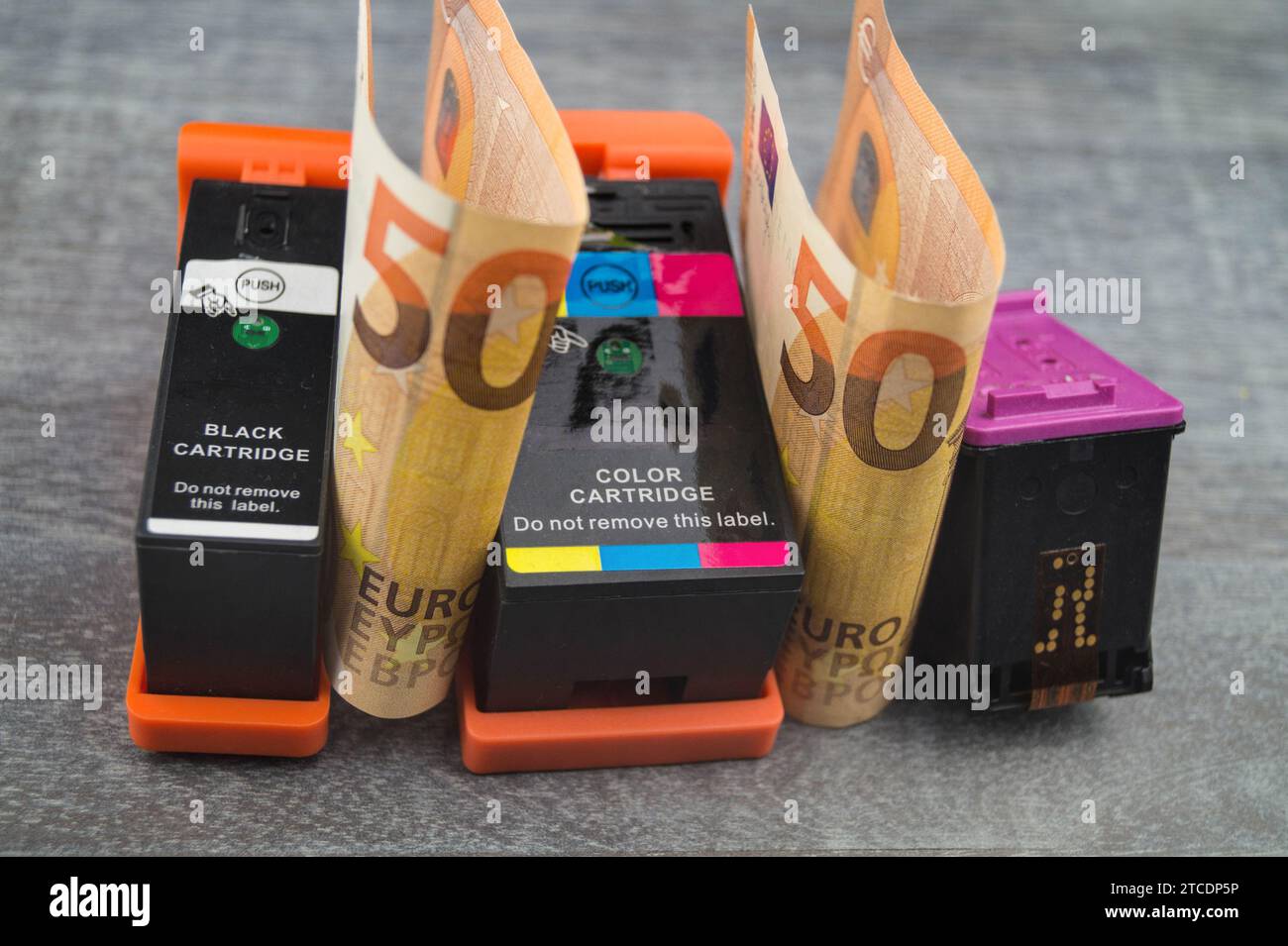 ink cartridges with Euro bills, symbol picture for print costs Stock ...