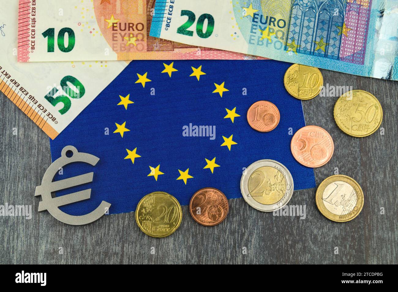 flag of EU with Euro sign, bills and coins, Europe Stock Photo - Alamy