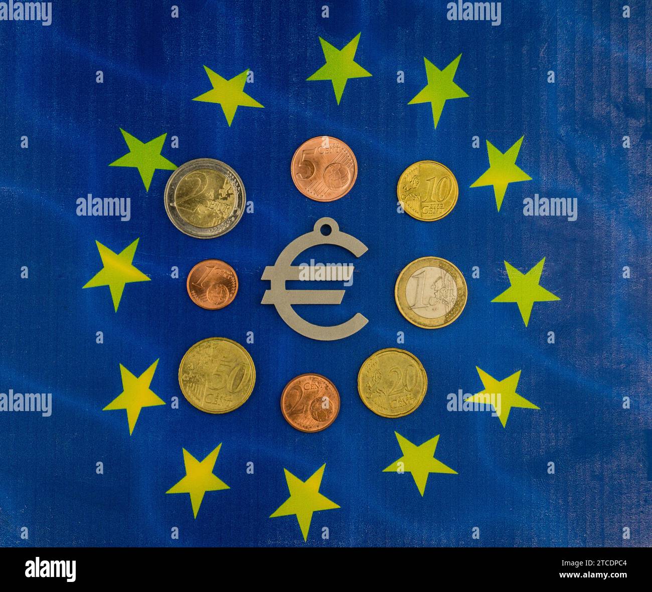 flag of EU with Euro sign and coins, Europe Stock Photo - Alamy