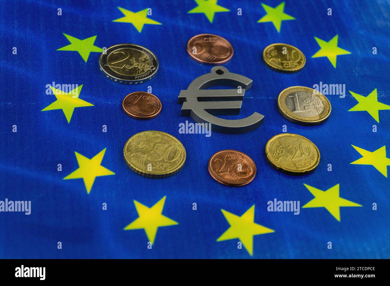 flag of EU with Euro sign and coins, Europe Stock Photo - Alamy