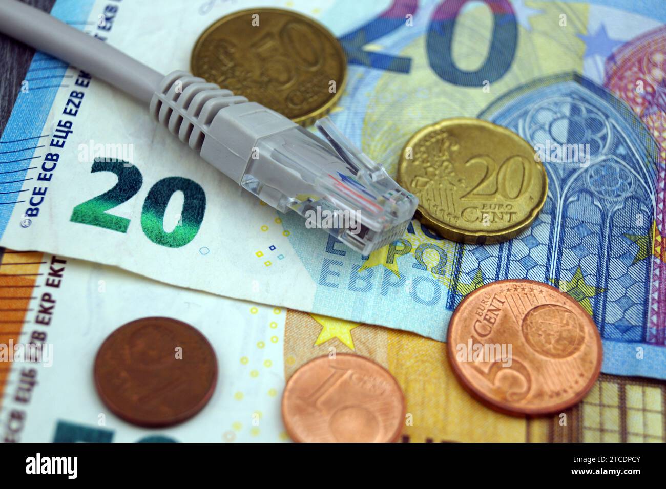 internet cable with Euro coins and bills, symbol picture for costs for ...