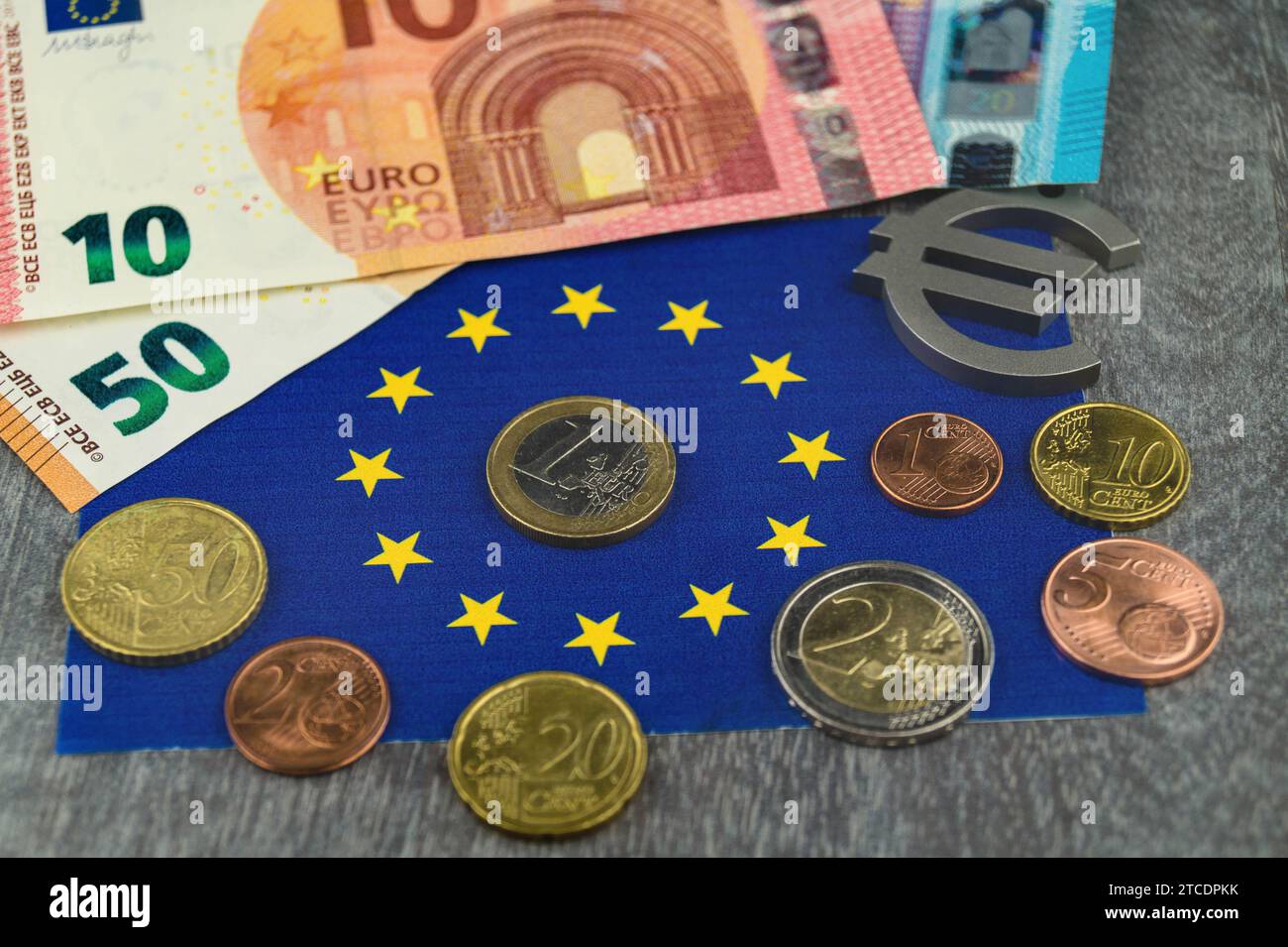 flag of EU with Euro sign, bills and coins, Europe Stock Photo - Alamy