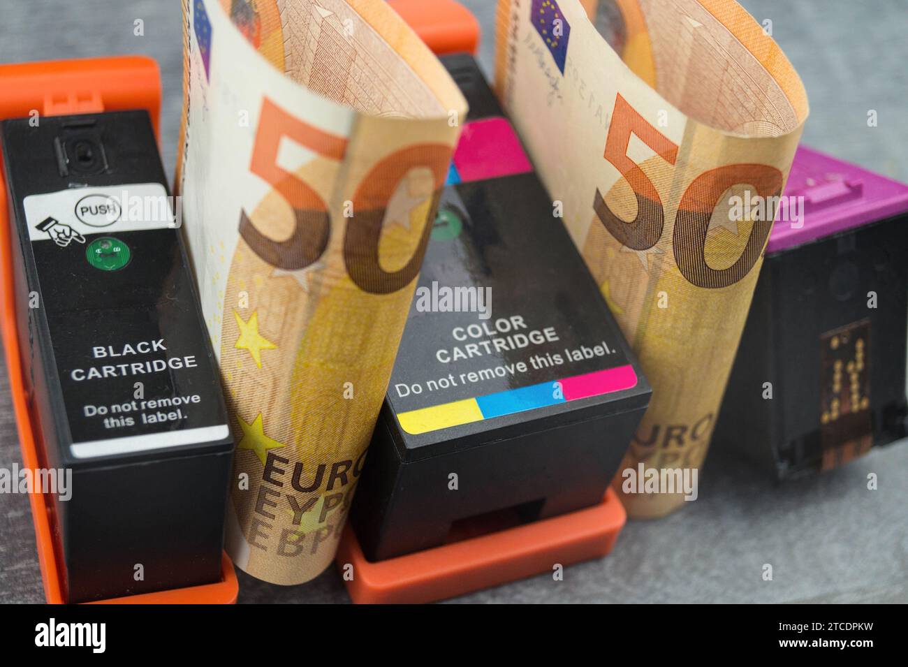 ink cartridges with Euro bills, symbol picture for print costs Stock ...