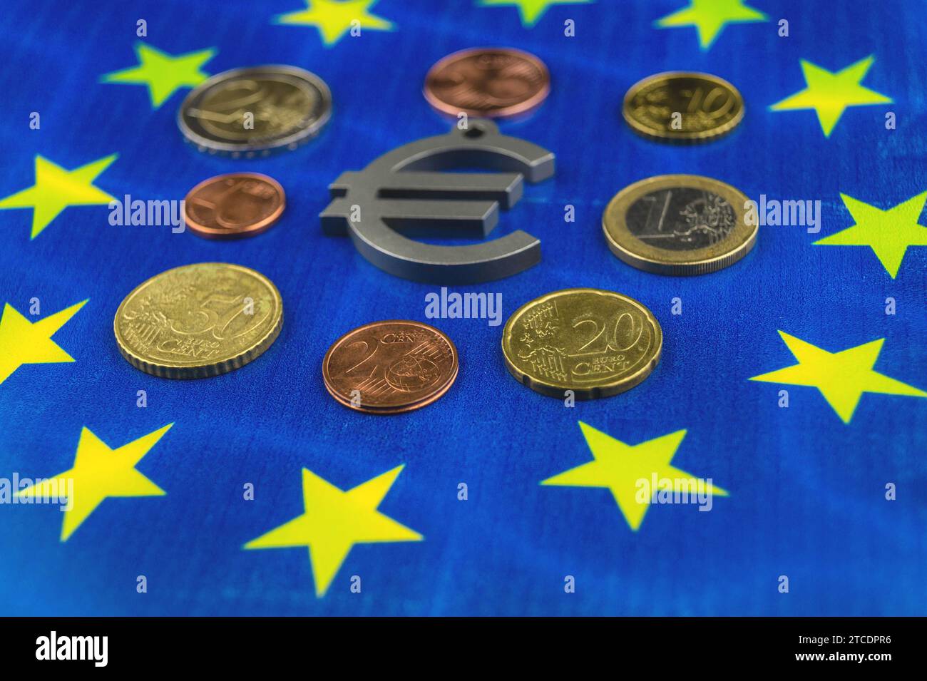 flag of EU with Euro sign and coins, Europe Stock Photo - Alamy